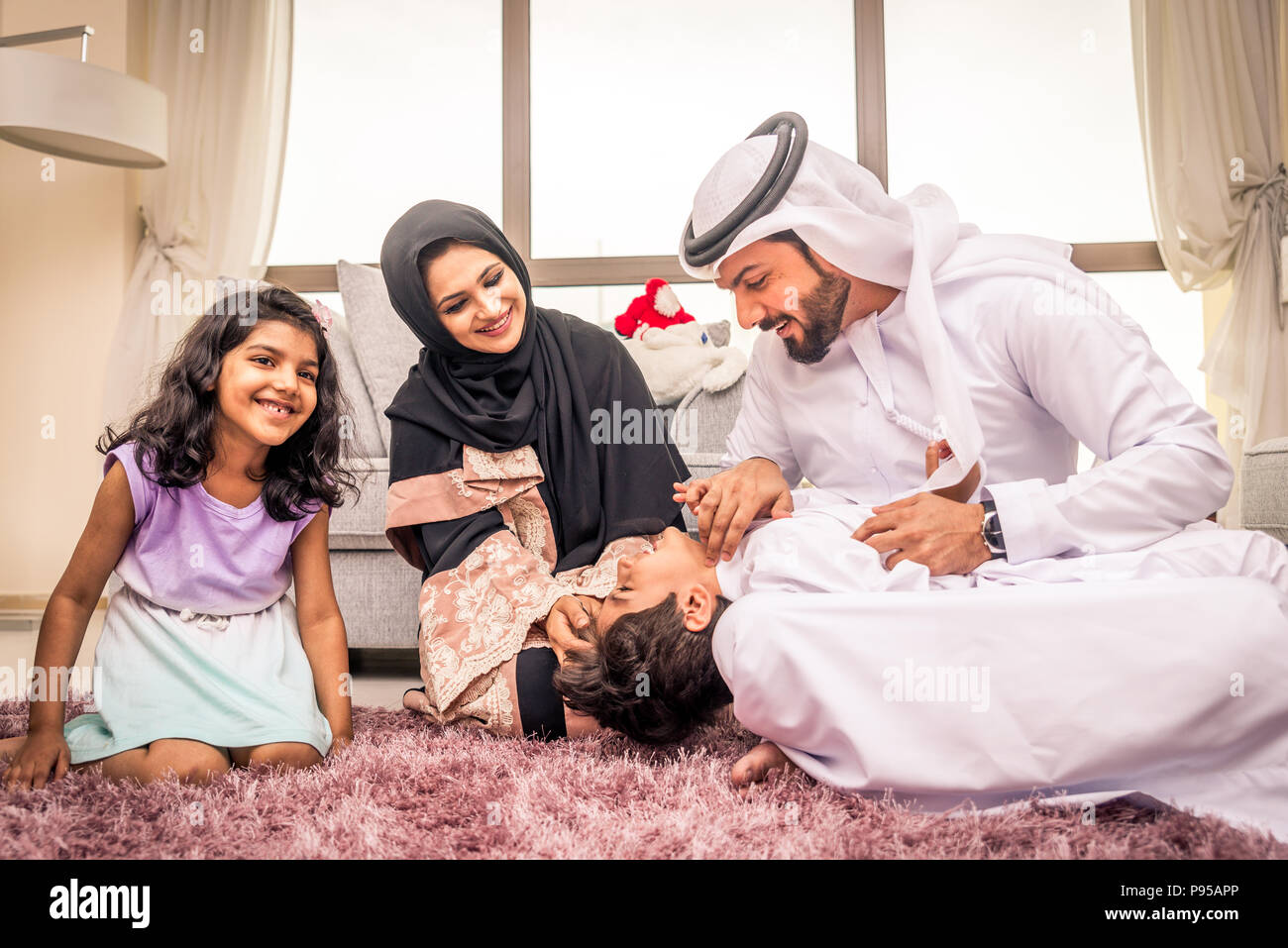 Happy arabian family having fun at home Stock Photo - Alamy