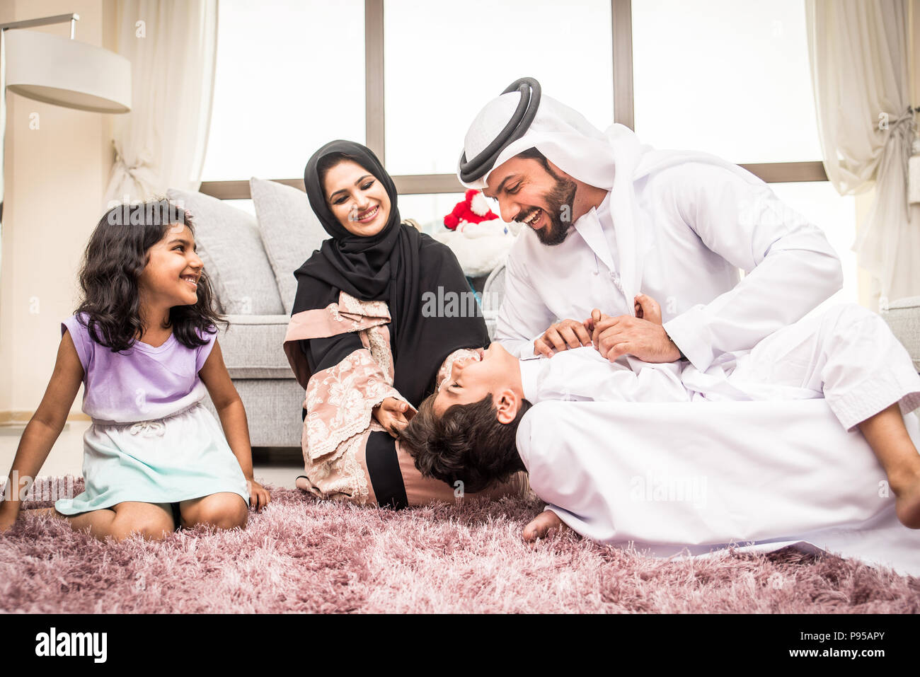 Happy arabian family having fun at home Stock Photo - Alamy
