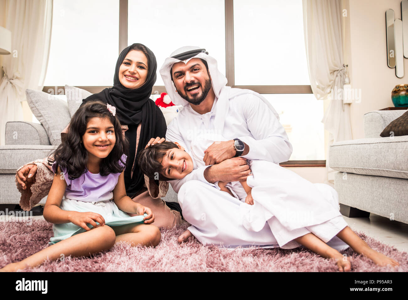 Happy arabian family having fun at home Stock Photo - Alamy