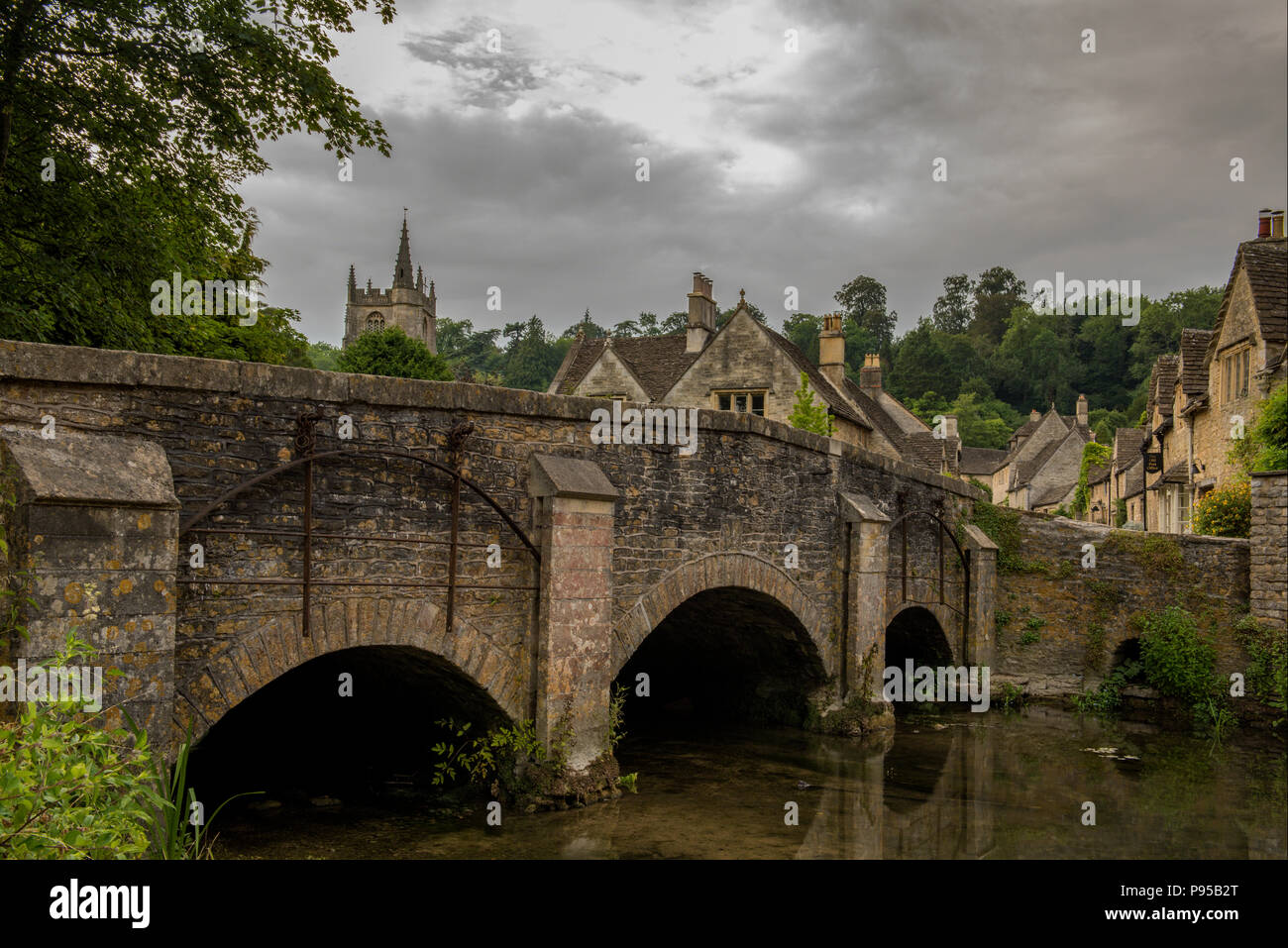Stone cottages near Bybrook river, Castle Combe, village, Cotswolds ...
