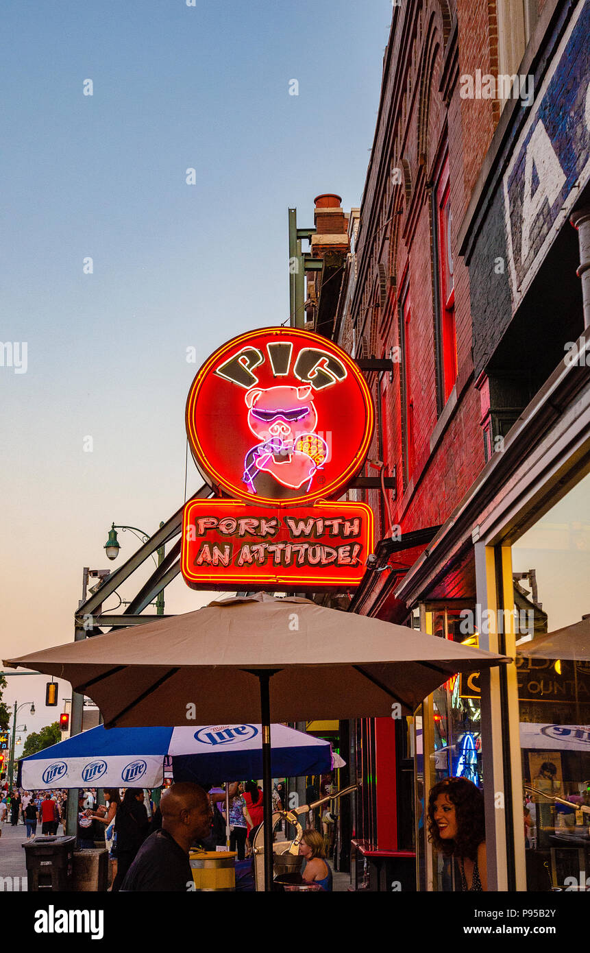 Pig's neon sign at dusk Stock Photo - Alamy