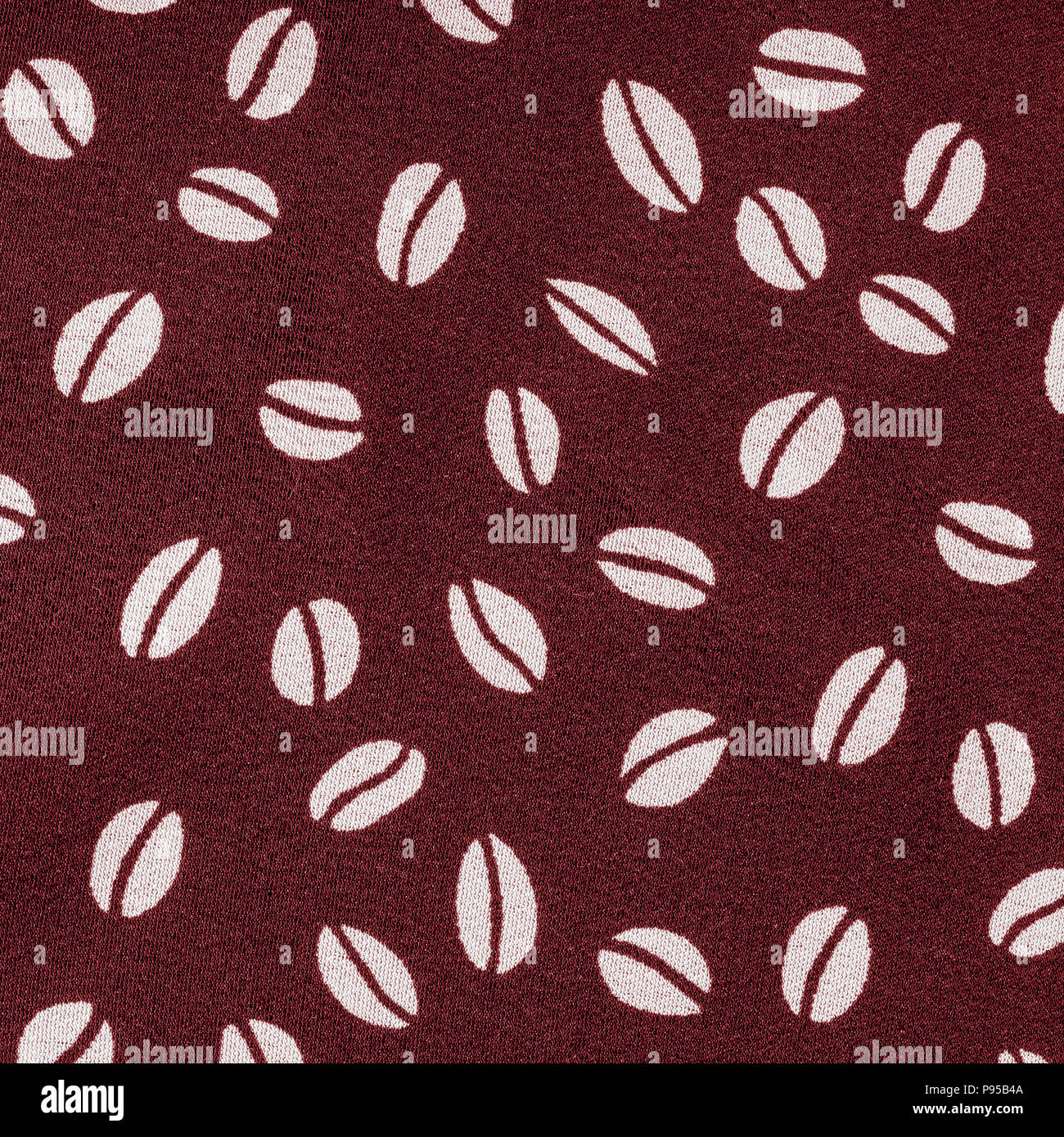 Red fabric texture with the pattern of coffee beans. Square, closeup ...