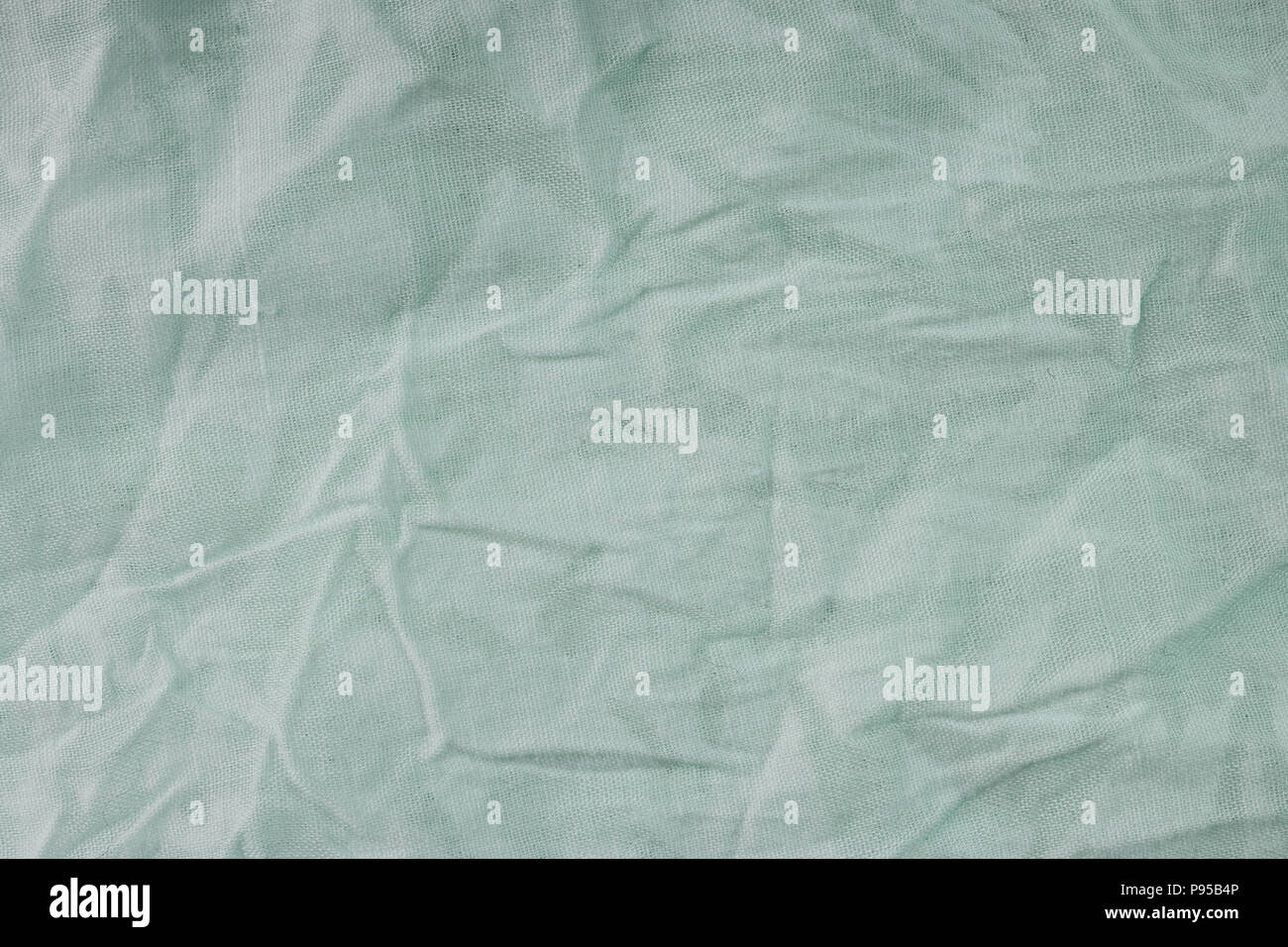 Green wrinkled fabric texture. Closeup Stock Photo - Alamy