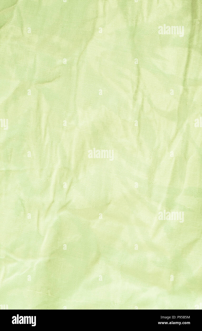 Yellow wrinkled fabric texture. Closeup Stock Photo - Alamy