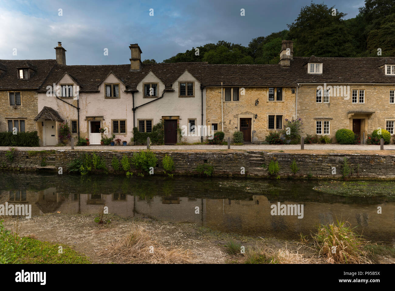 Stone cottages near Bybrook river, Castle Combe, village, Cotswolds ...