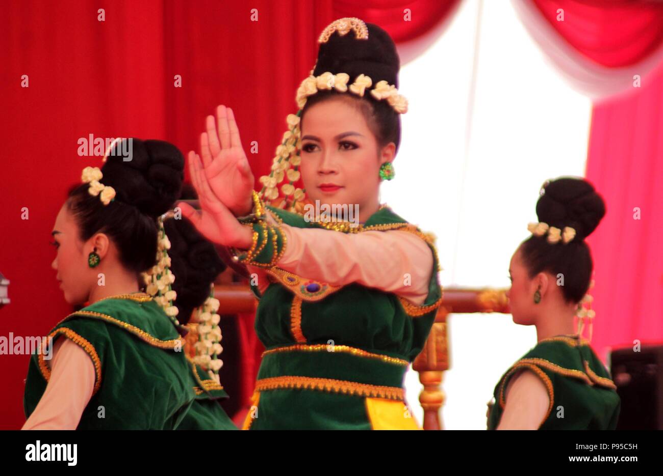 Madiun, Indonesia. 13th July, 2018. A number of people wearing costumes ...
