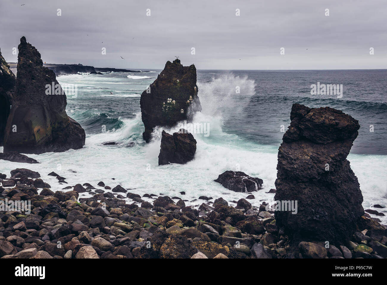 Rocks in front of Valahnukur mount on a North Atlantic shore in ...