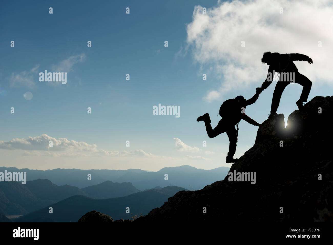 Mountain Climbers Helping Stock Photos & Mountain Climbers Helping ...