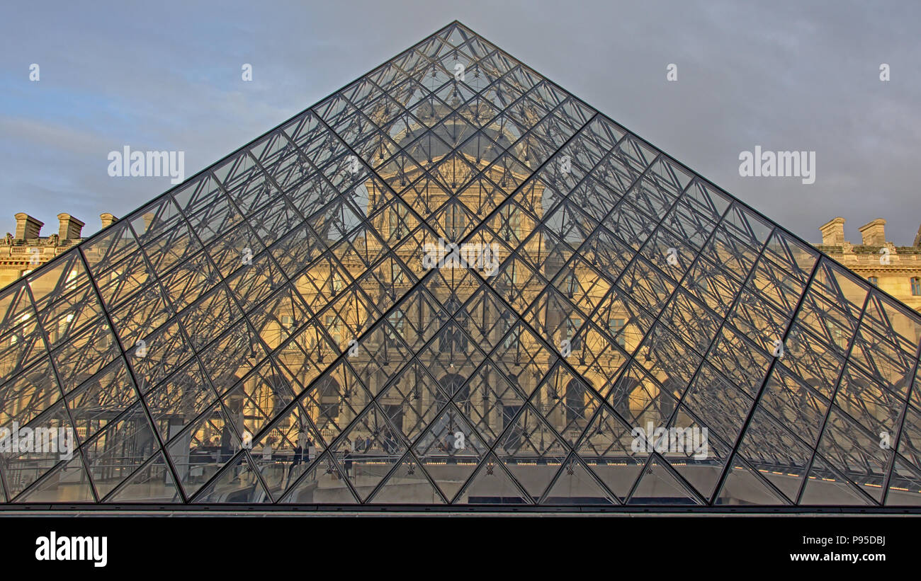 Glass pyramid in front of neo renaissance palace, of the Louvre museum ...