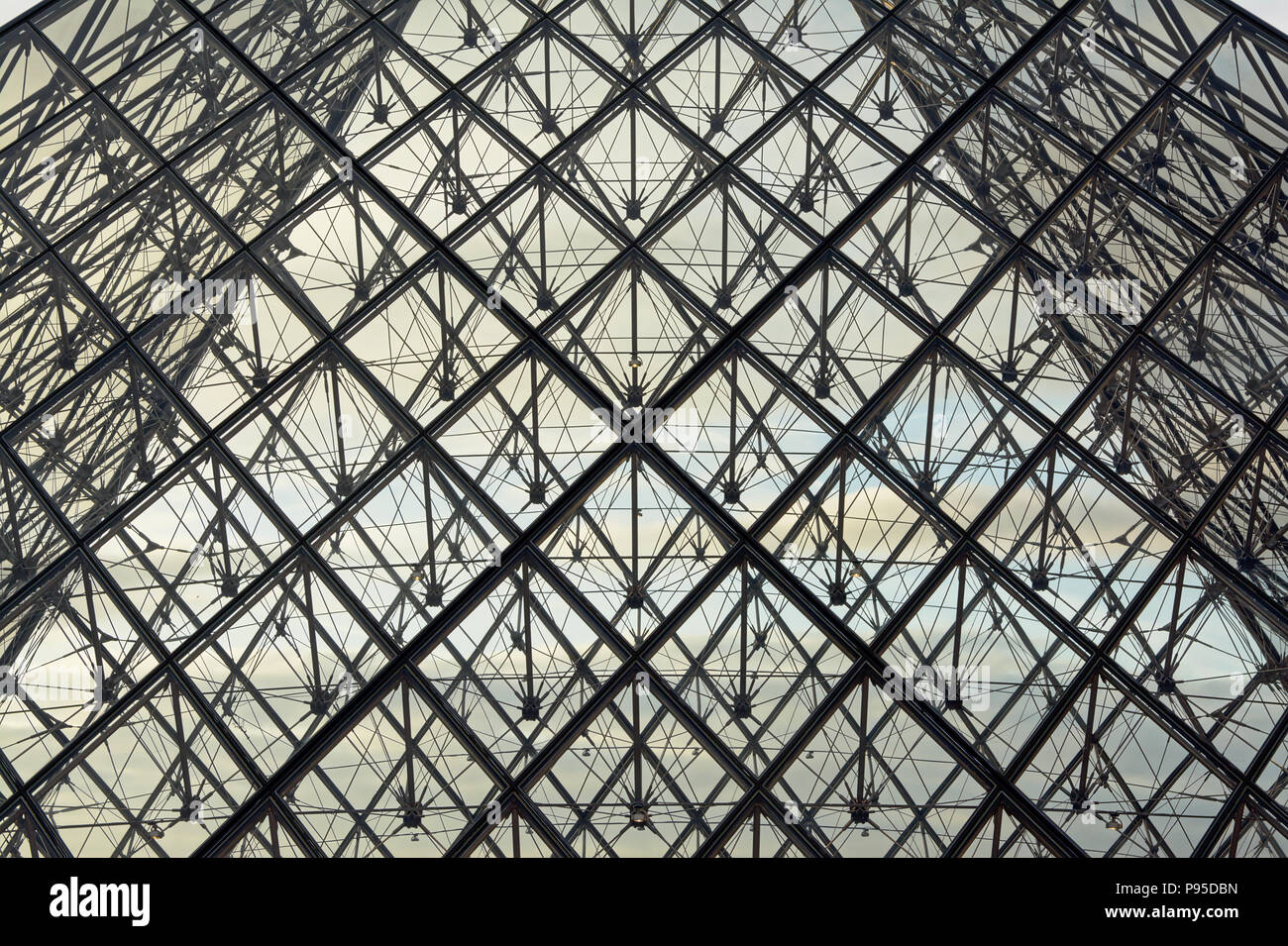 Abstract geometric detail of the glass and steel pyramid of the Louvre ...