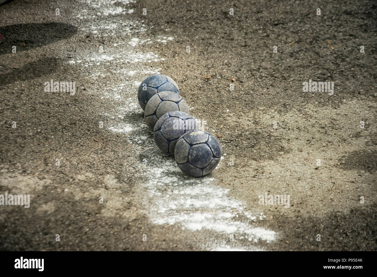 A line with four balote balls lined up Stock Photo - Alamy
