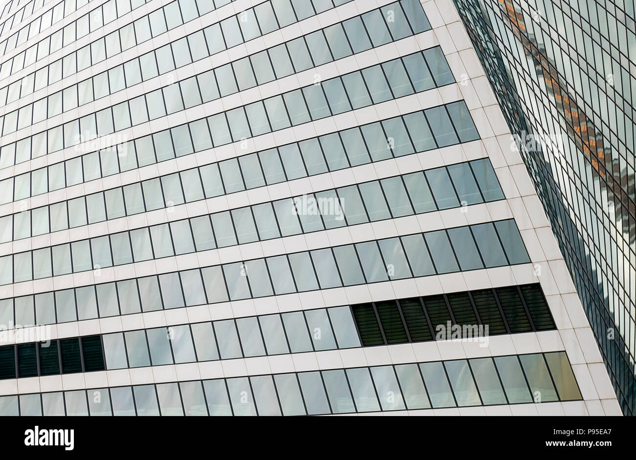 Modern minimalistic architecture with a lot of square glass windows and ...