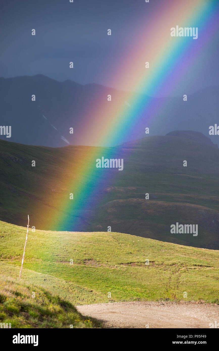 Beautiful Colorful rainbow over the Colorado Mountains Stock Photo - Alamy