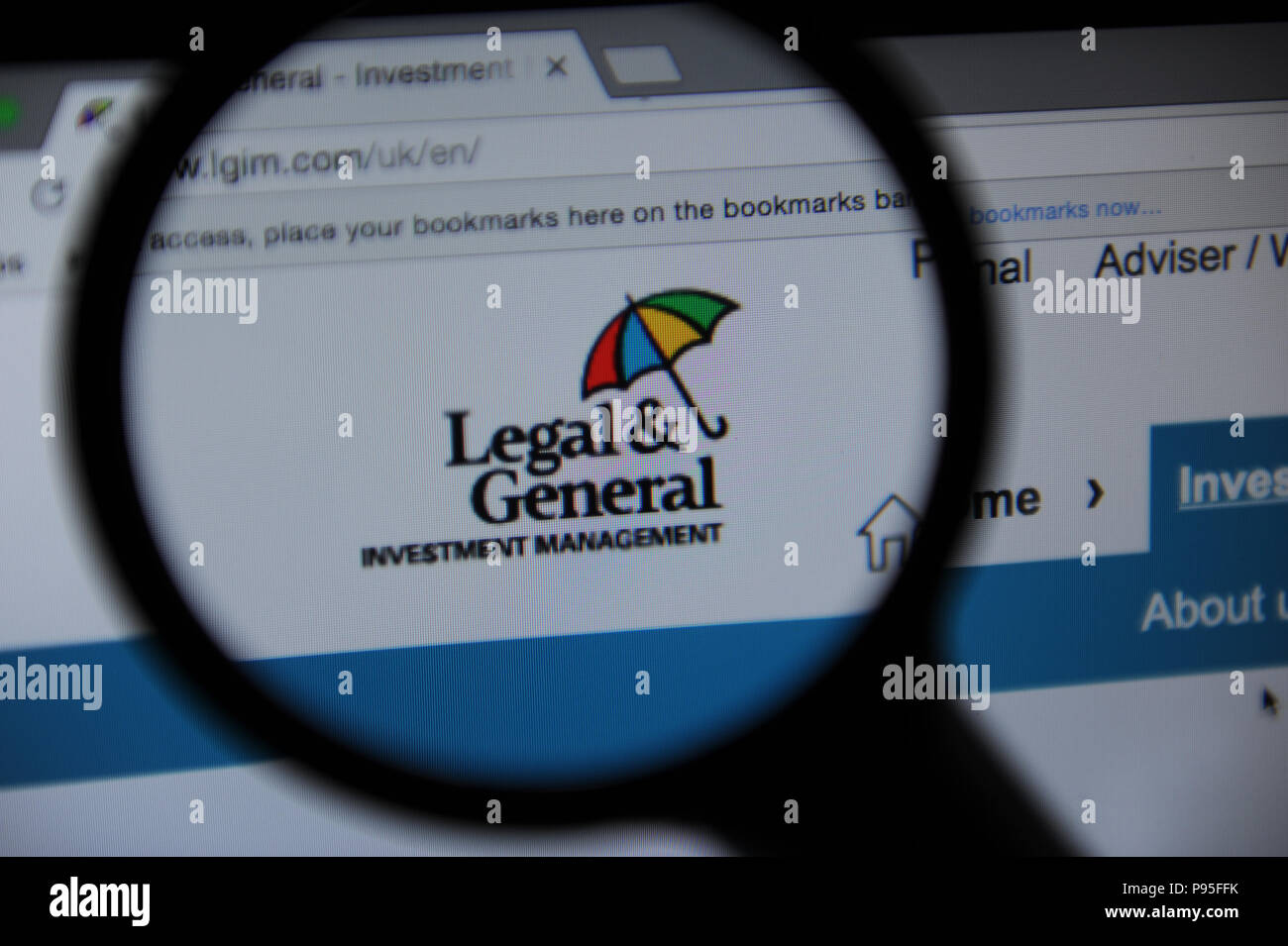 The Legal & General website seen through a magnifying glass Stock Photo ...