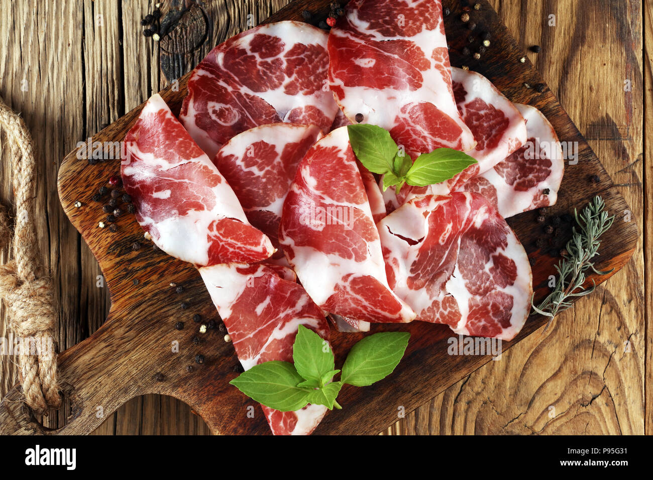 Italian sliced cured coppa with spices. Raw ham. Crudo or jamon Stock ...