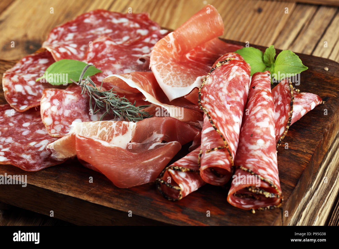 Food tray with delicious salami, raw ham and italian crudo or jamon ...