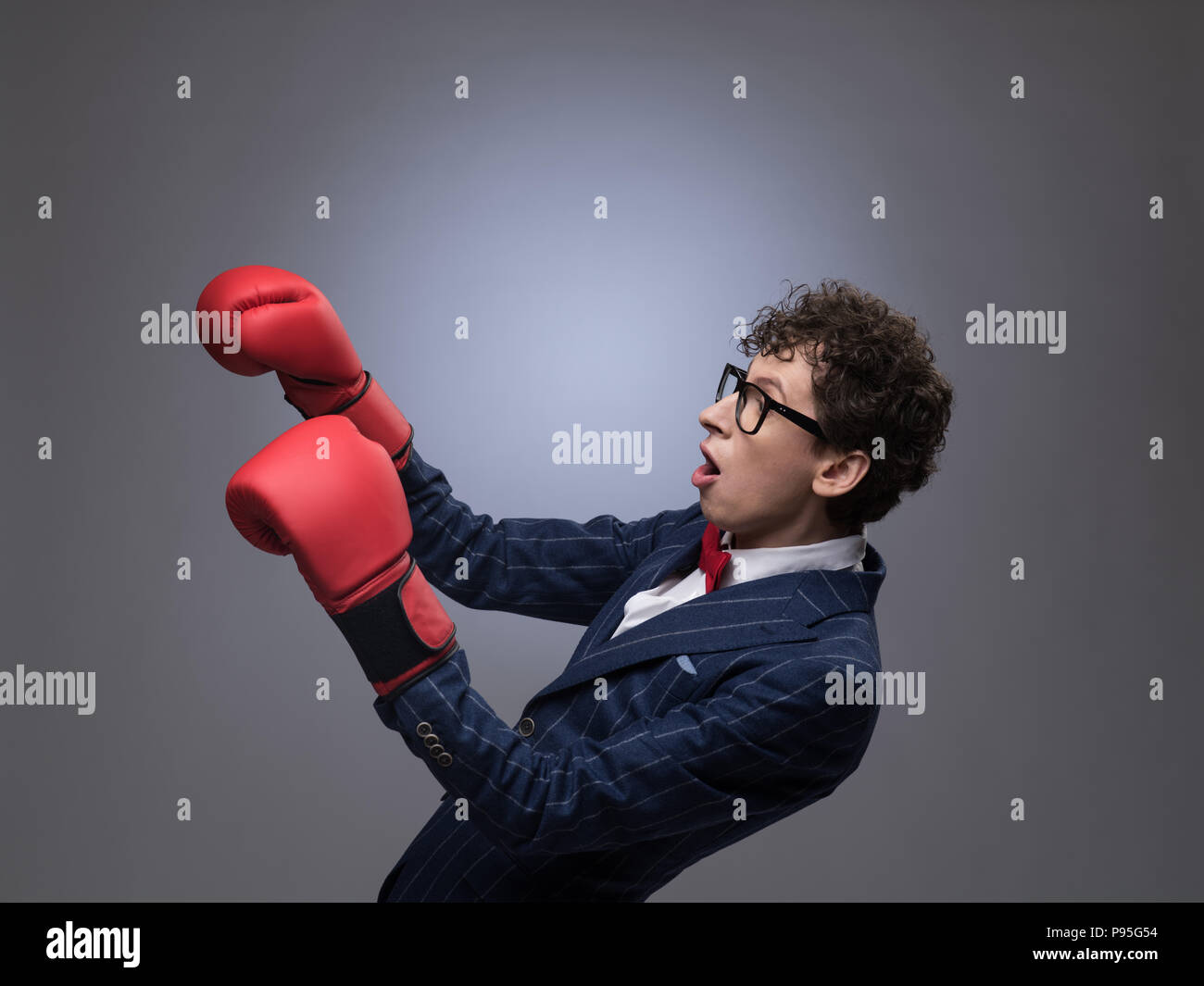 Businessman in boxing gloves falling in knockout Stock Photo - Alamy