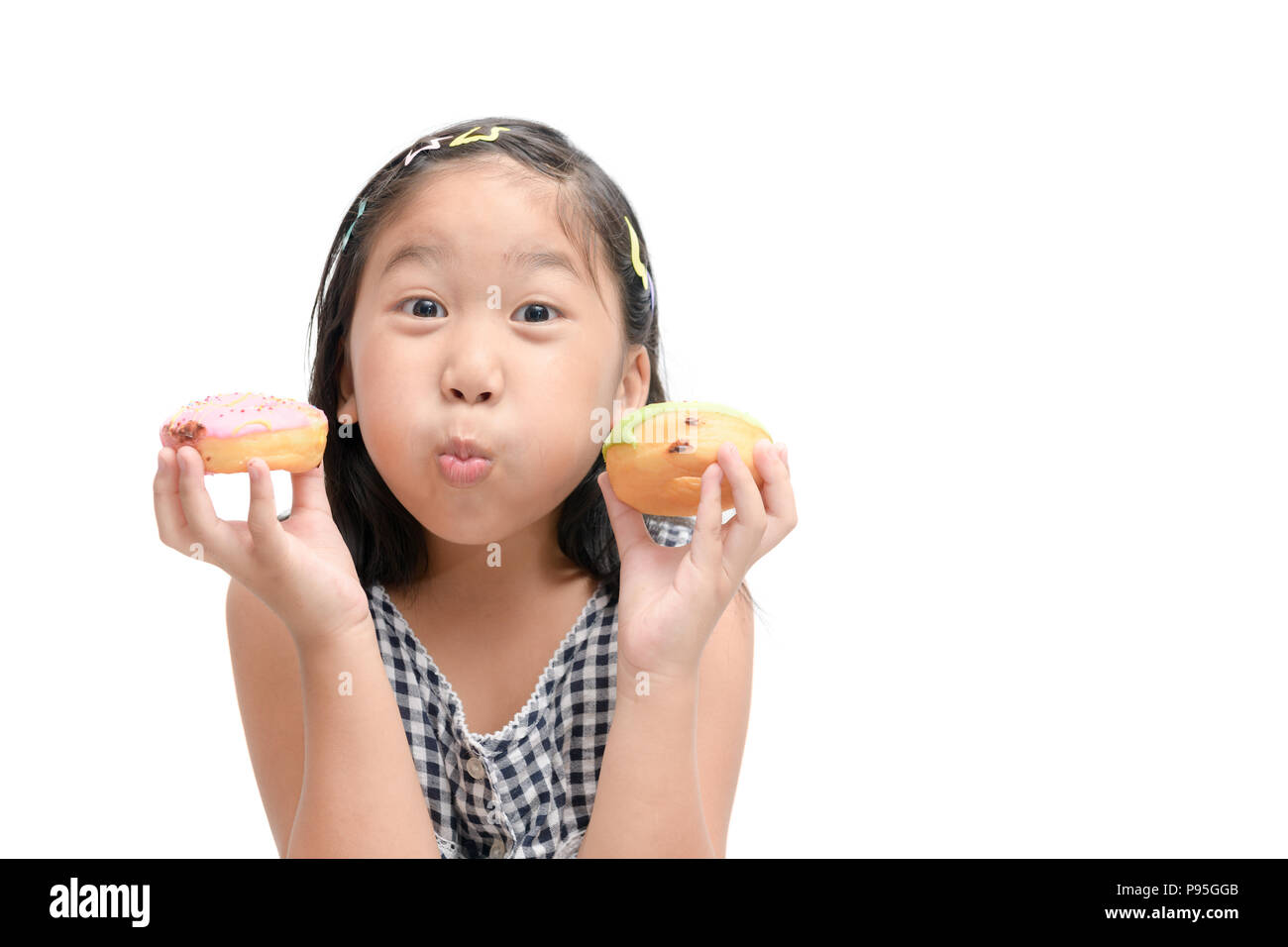Happy cute girl is eating donut isolated on white background Stock ...