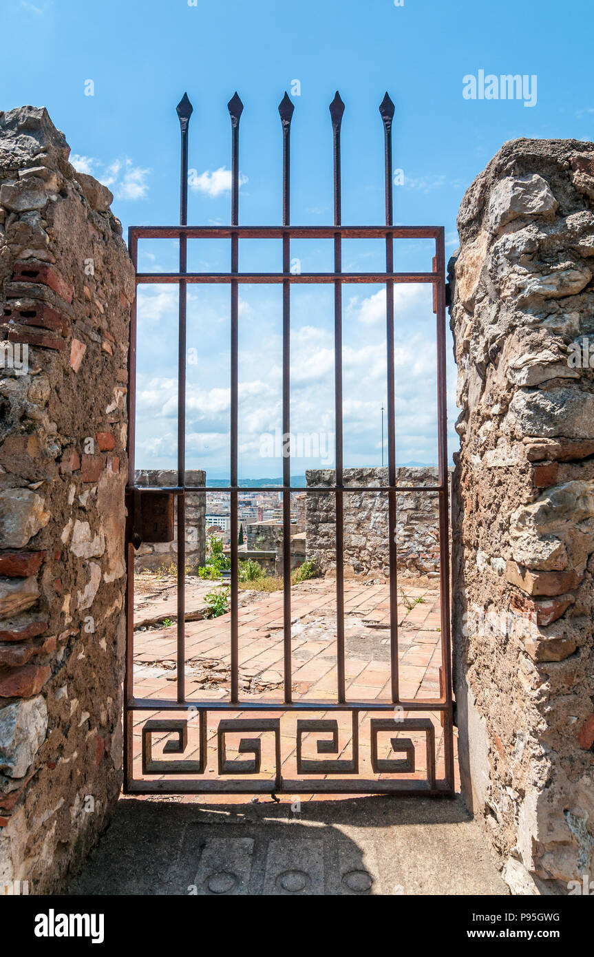 wrought iron gate, roman walls, street in old town Girona, Girona ...