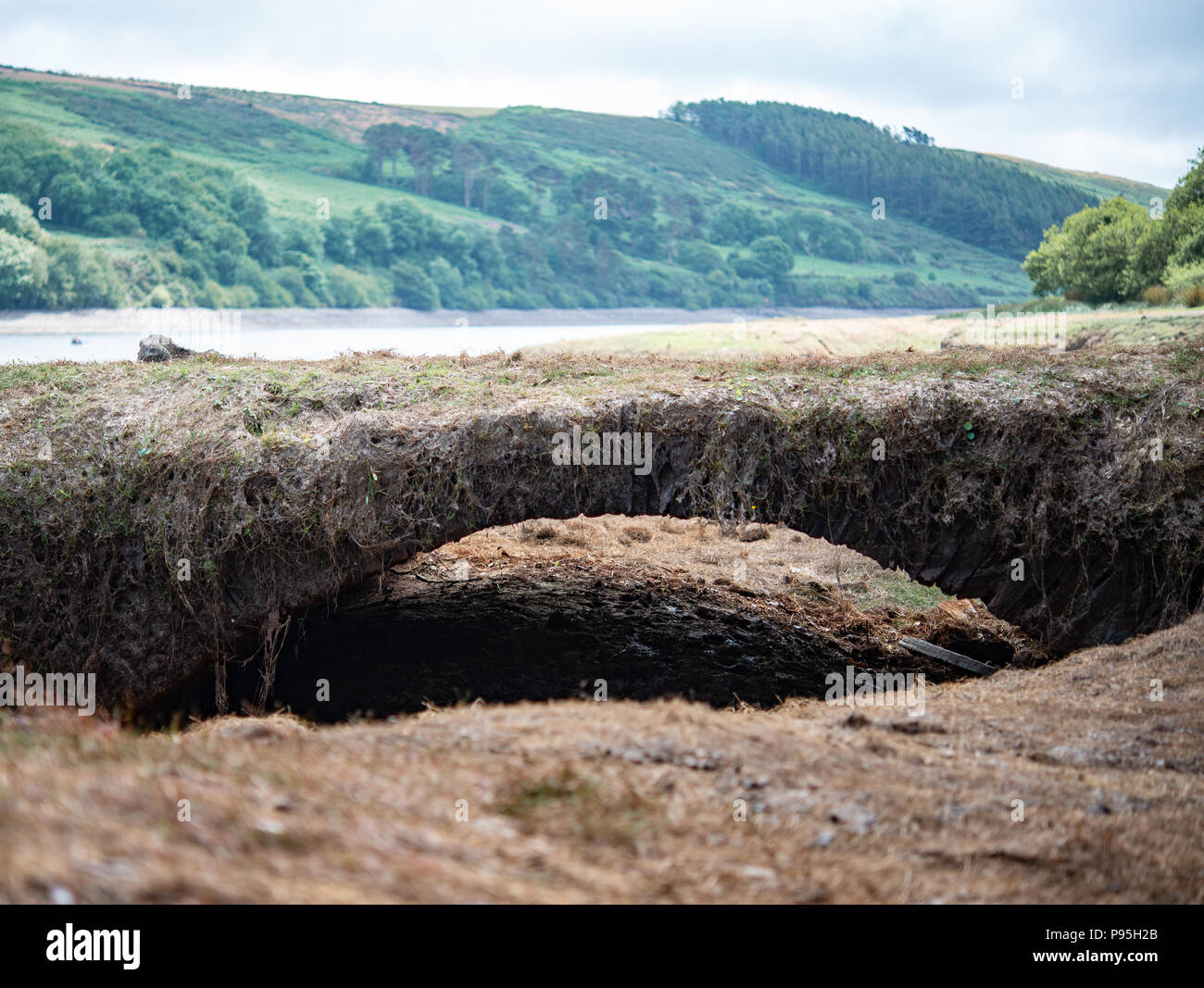 Old stone bridge uncovered by dry weather at Injebreck reservoir Stock ...