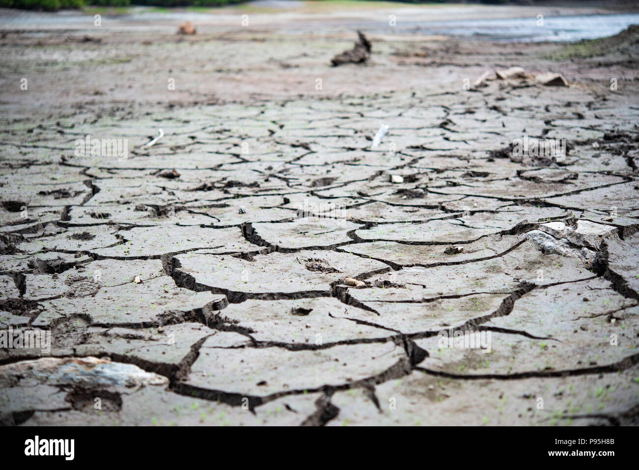 Dry cracked mud at the bottom of dried reservoir Injebreck Isle Of Man ...