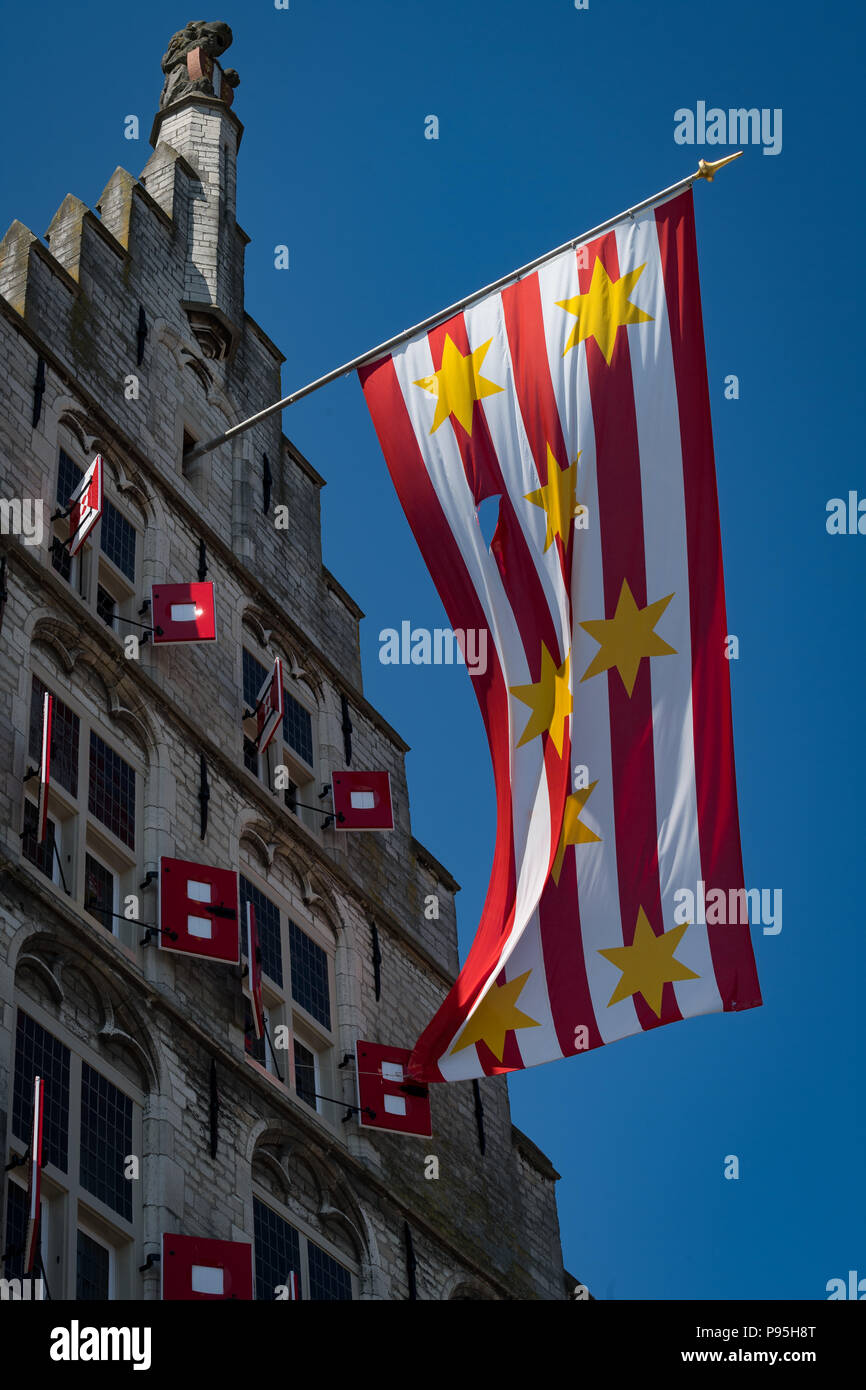 Gouda City Hall with flags during the weekly cheese market Stock Photo ...