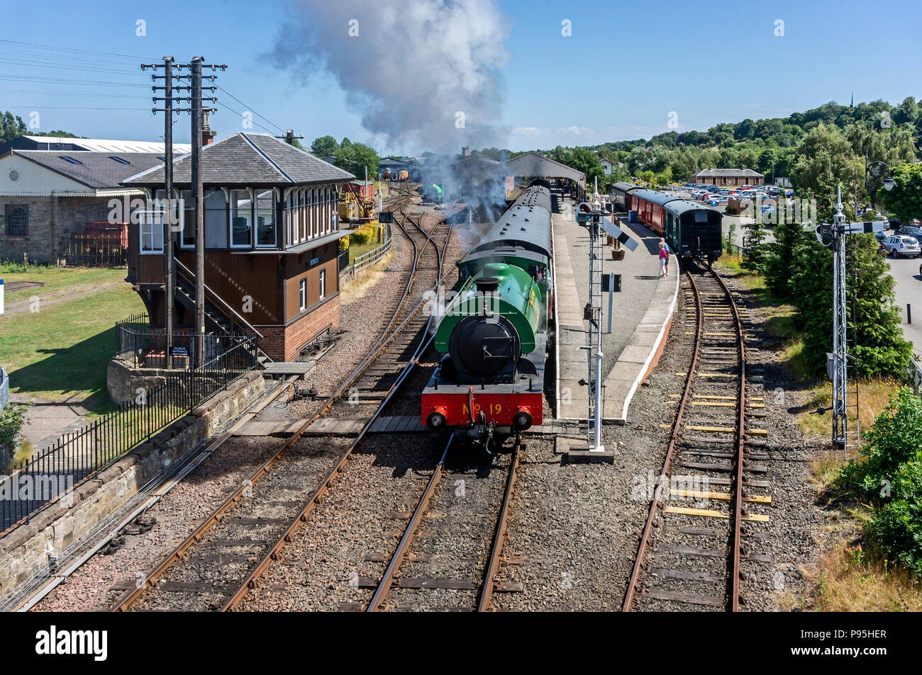 National Coal Board saddle tank steam engine No. 19 heading a train at ...
