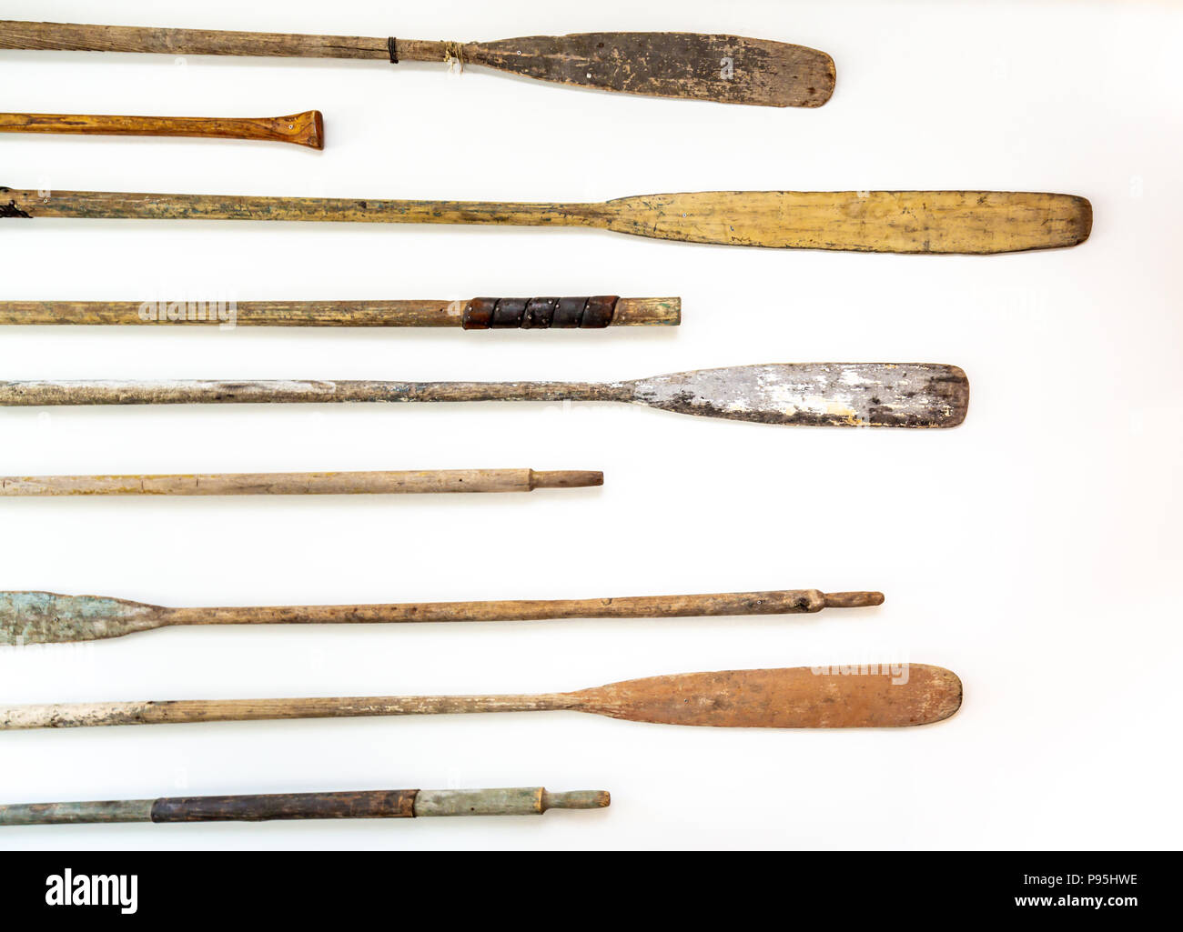 a collection of oars on a white wall Stock Photo - Alamy