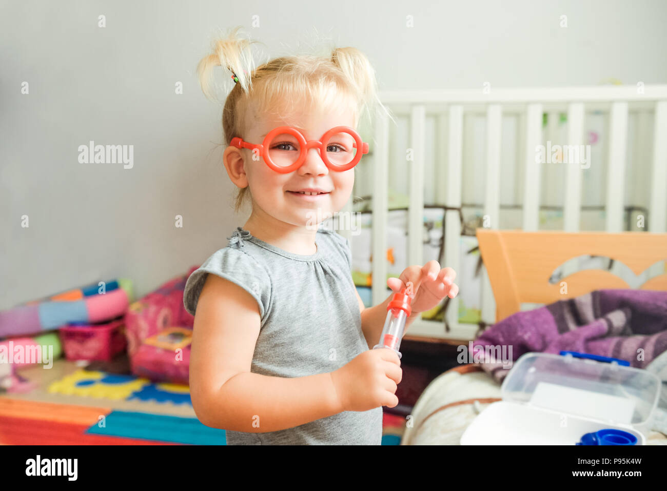 Child playing doctor syringe hi-res stock photography and images - Alamy
