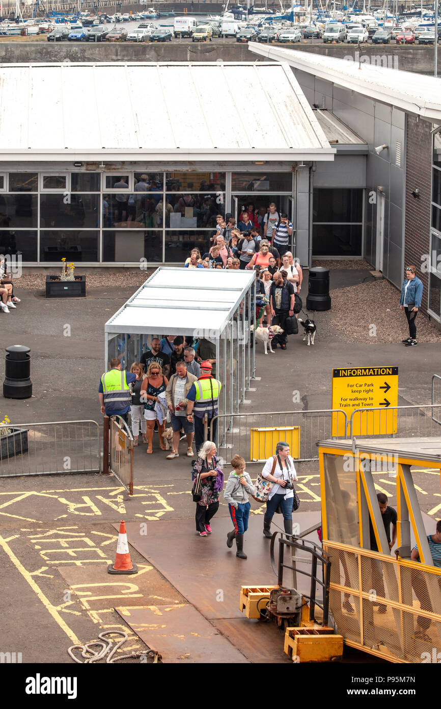 Foot passengers at Ardrossan Harbour preparing to board NV Caledonian ...