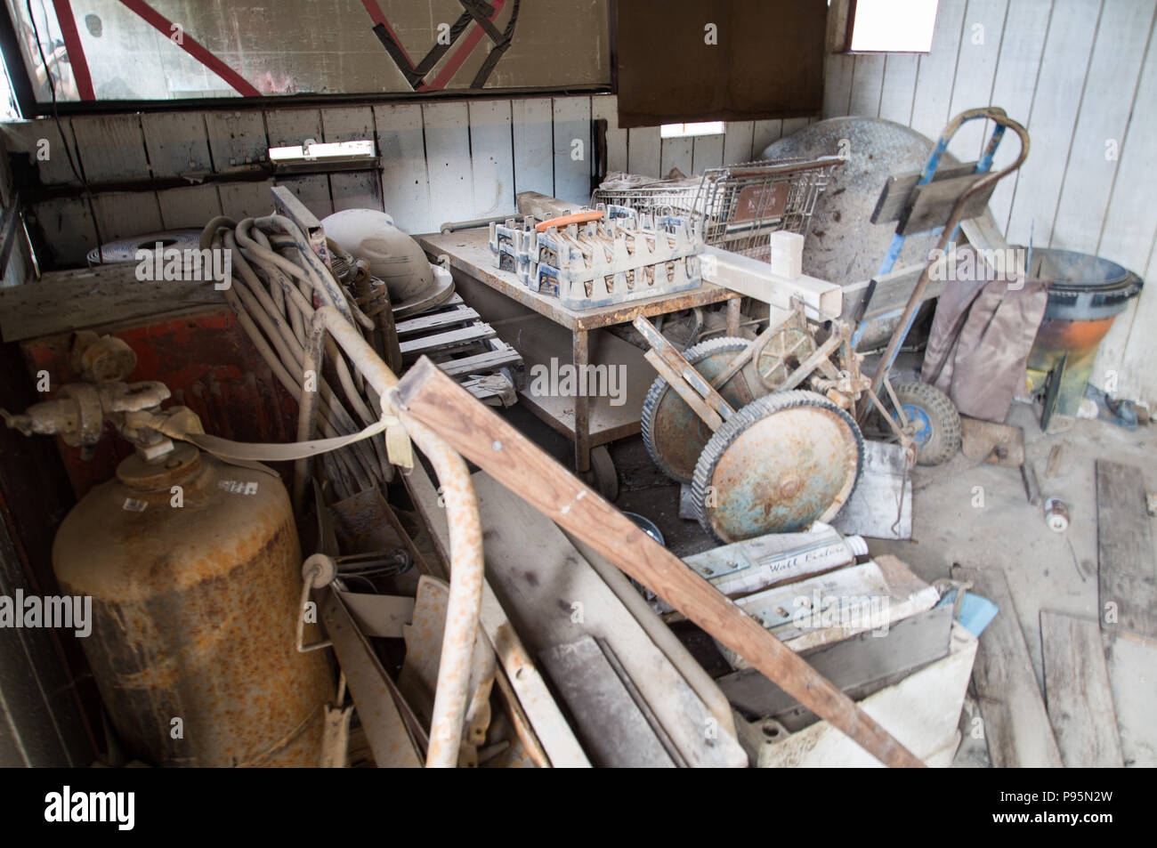 Old, rusty objects and furniture at the abandoned J's Amusement Park in ...
