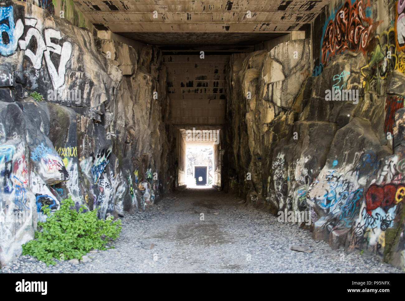 Light coming through one of the abandoned Donner Pass tunnels outside ...