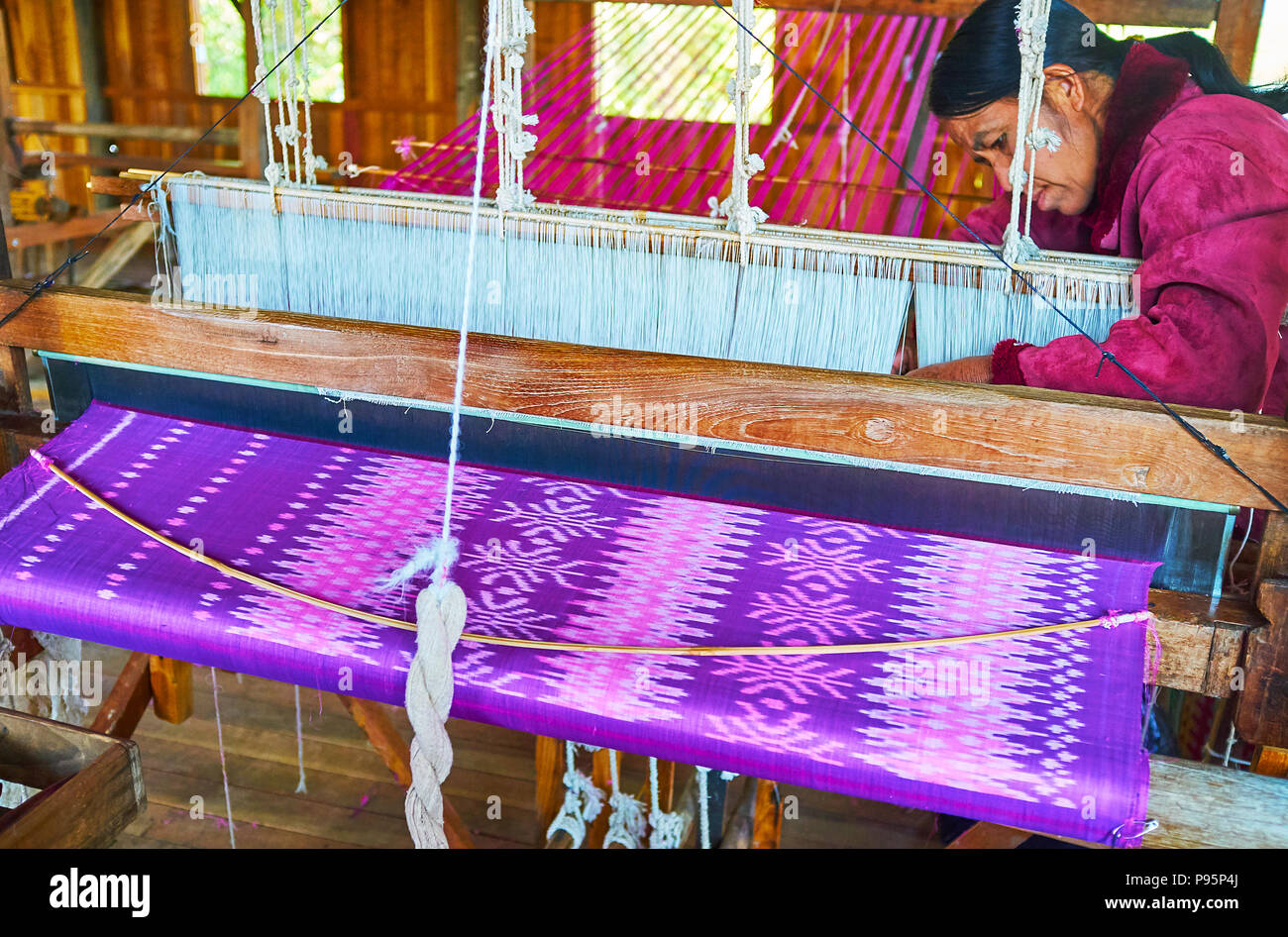 INPAWKHON, MYANMAR - FEBRUARY 18, 2018: Production of silk fabric ...