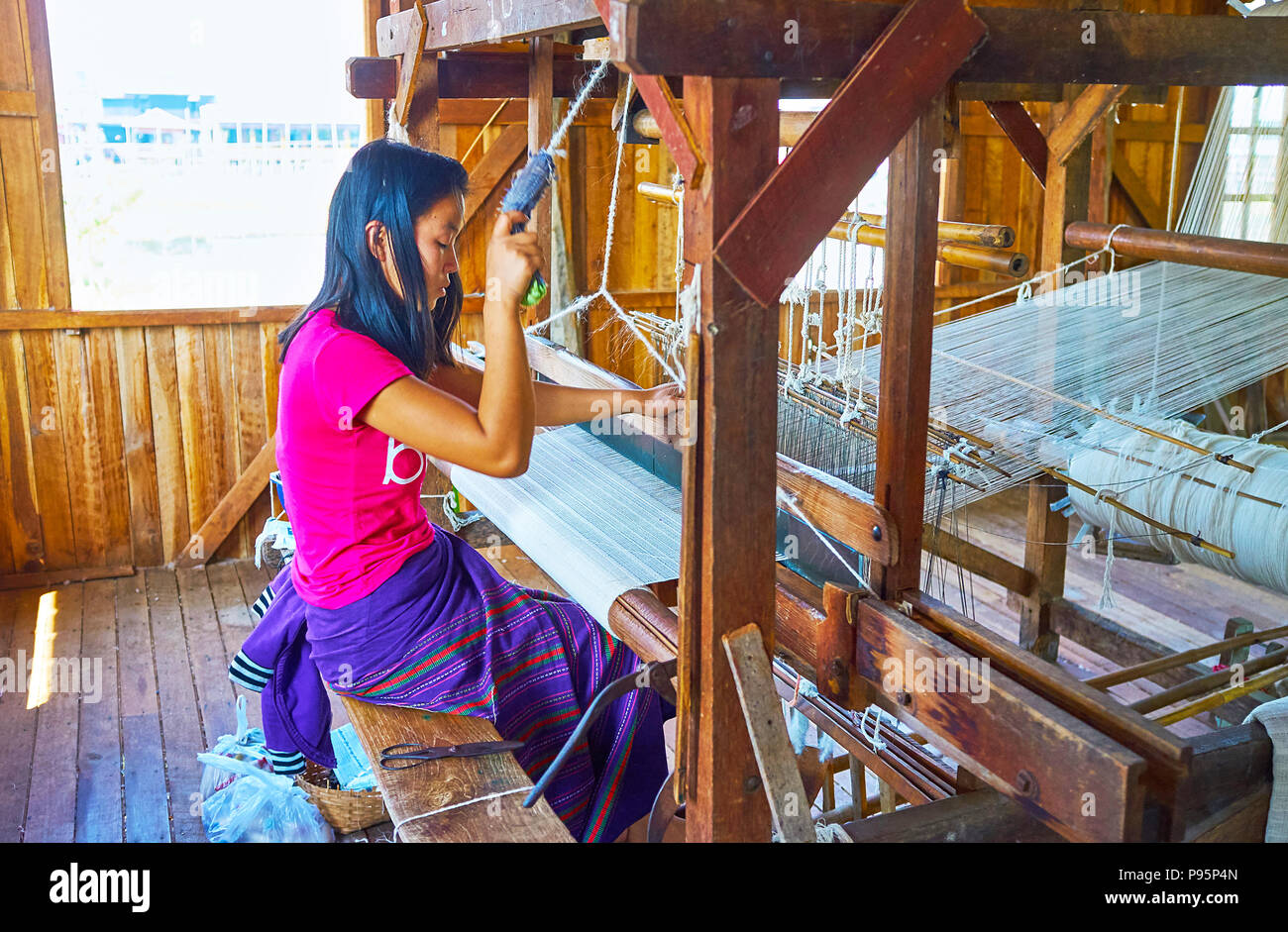 INPAWKHON, MYANMAR - FEBRUARY 18, 2018: Production of lotus fabric ...