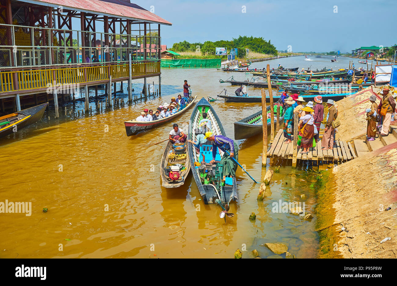 INLE LAKE, MYANMAR - FEBRUARY 18, 2018: The food vendor sells local ...