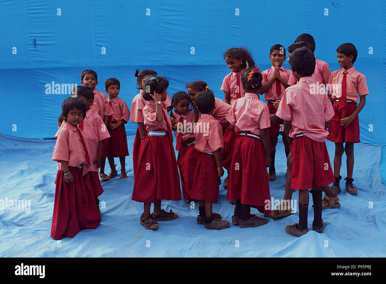Group of school kids enjoy, blue screen background Stock Photo - Alamy
