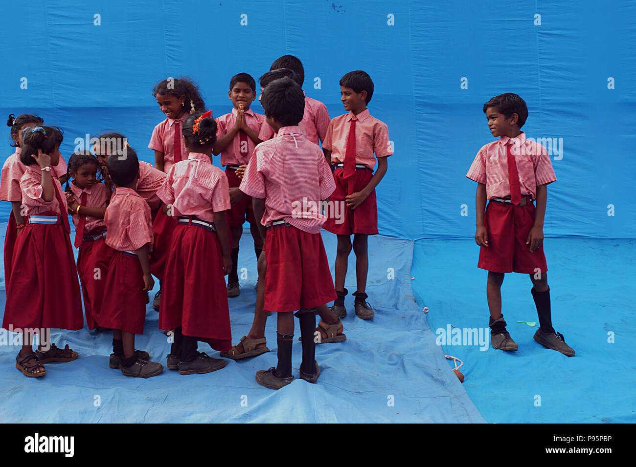 Group of school kids enjoy, blue screen background Stock Photo - Alamy