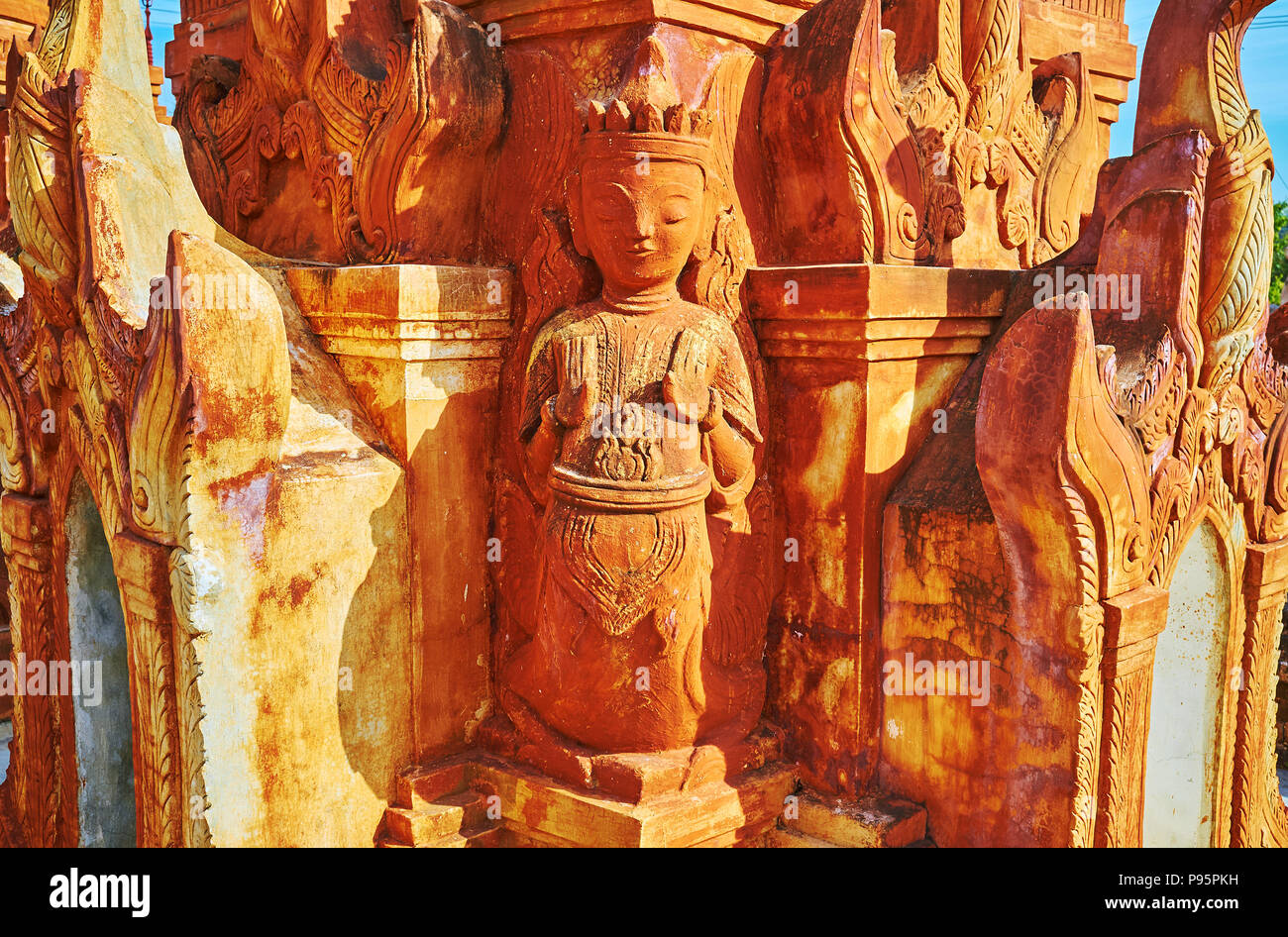 Detail of relief decoration of ochre stupa in Nyaung Ohak - the statue ...