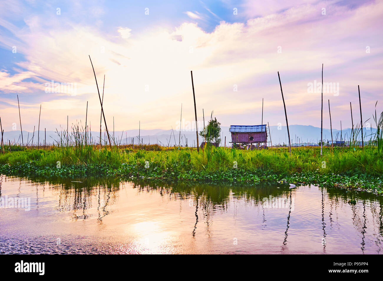 The beautiful sunset on Inle Lake - the bright sky over the floating ...