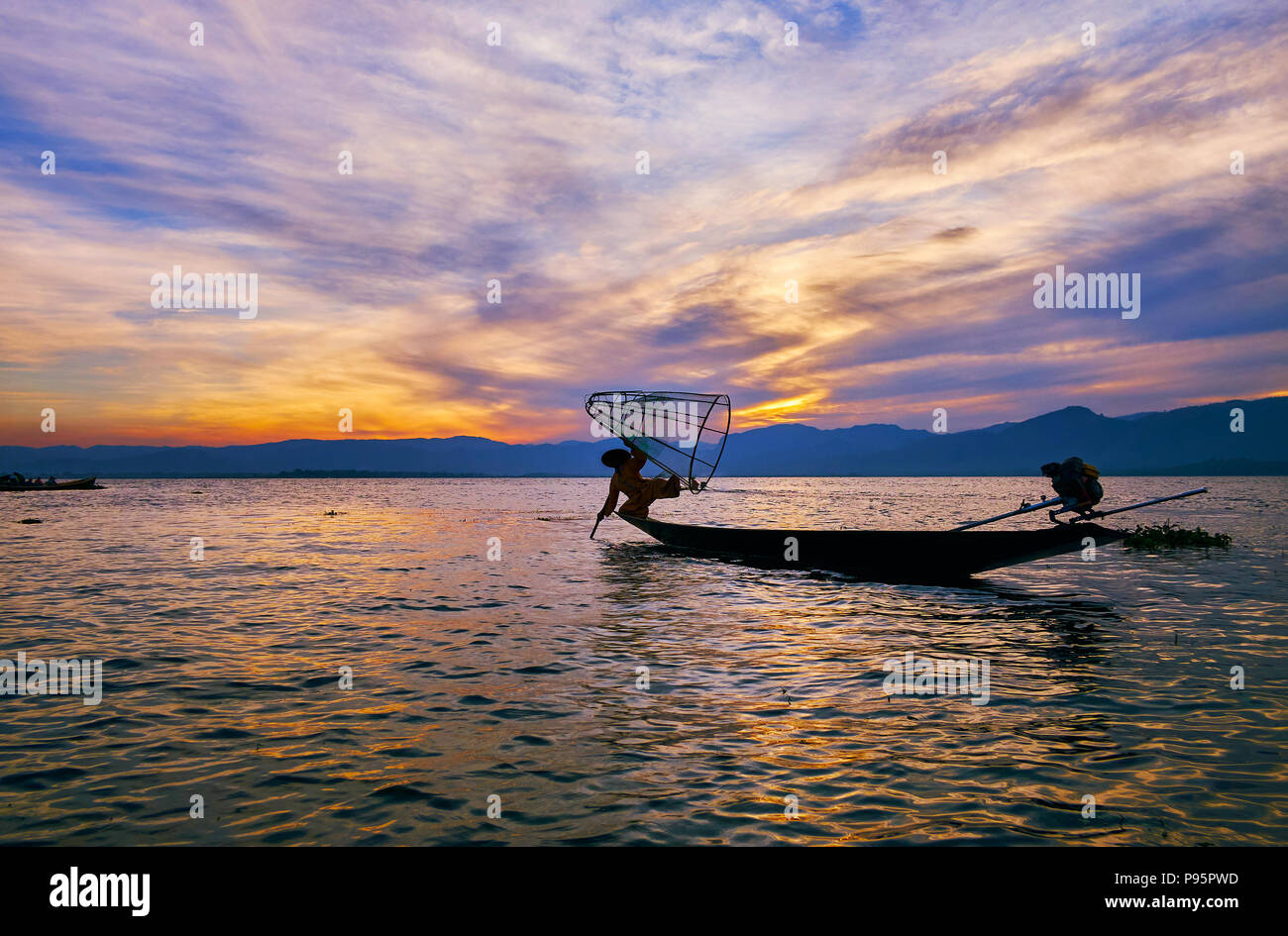The art of sunset fishing on Inle Lake - Burmese fisherman shows his ...