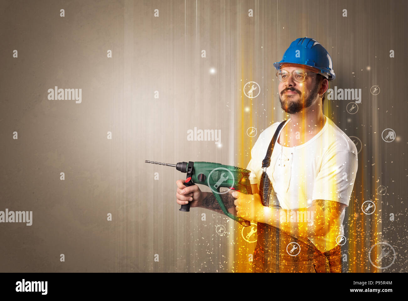 Manual worker with wrench symbols and tool Stock Photo - Alamy