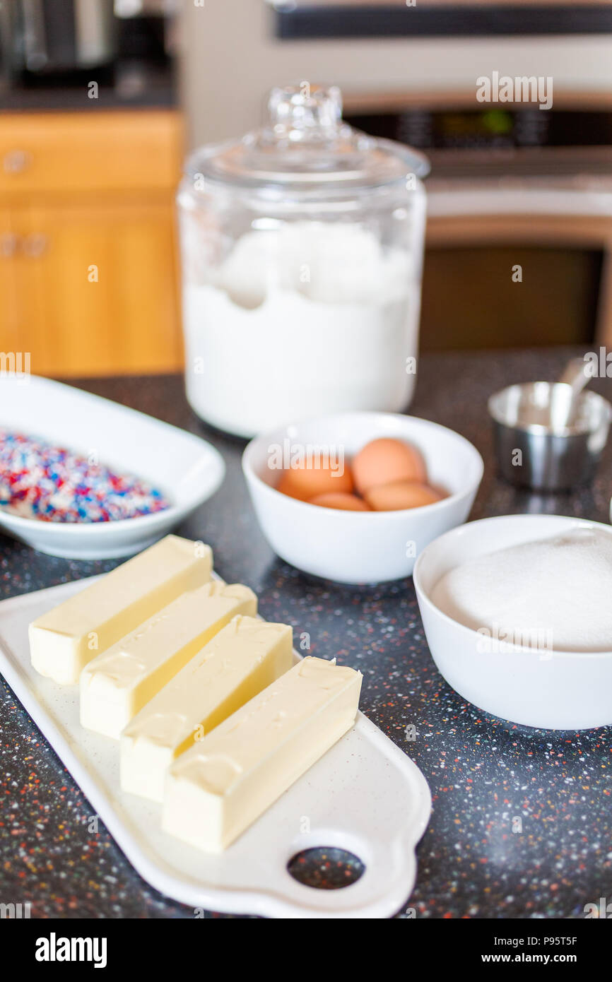 Step by step. Ingredients to bake sugar cookies on the kitchen counter ...