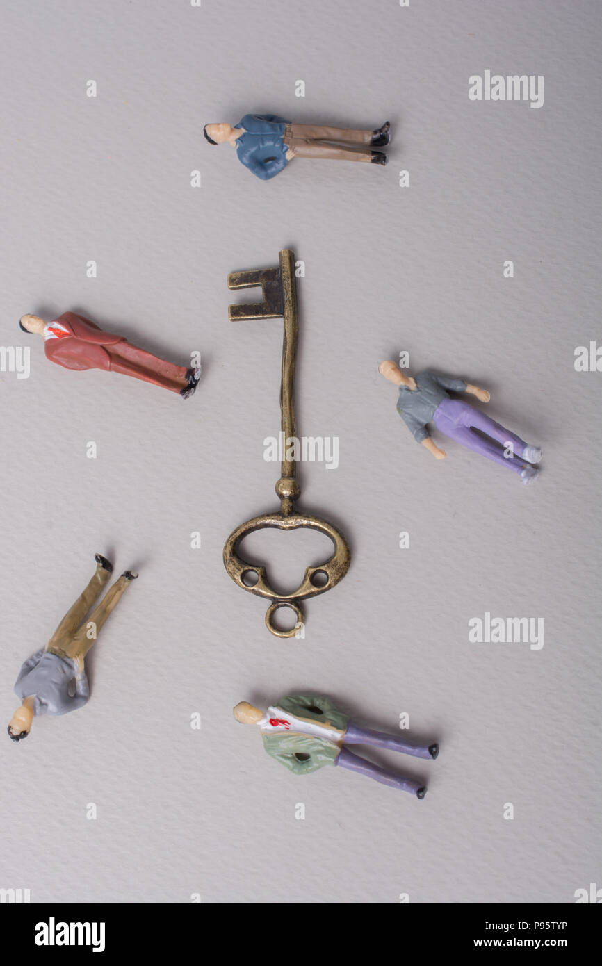 Tiny figurine of man miniature and retro key Stock Photo - Alamy