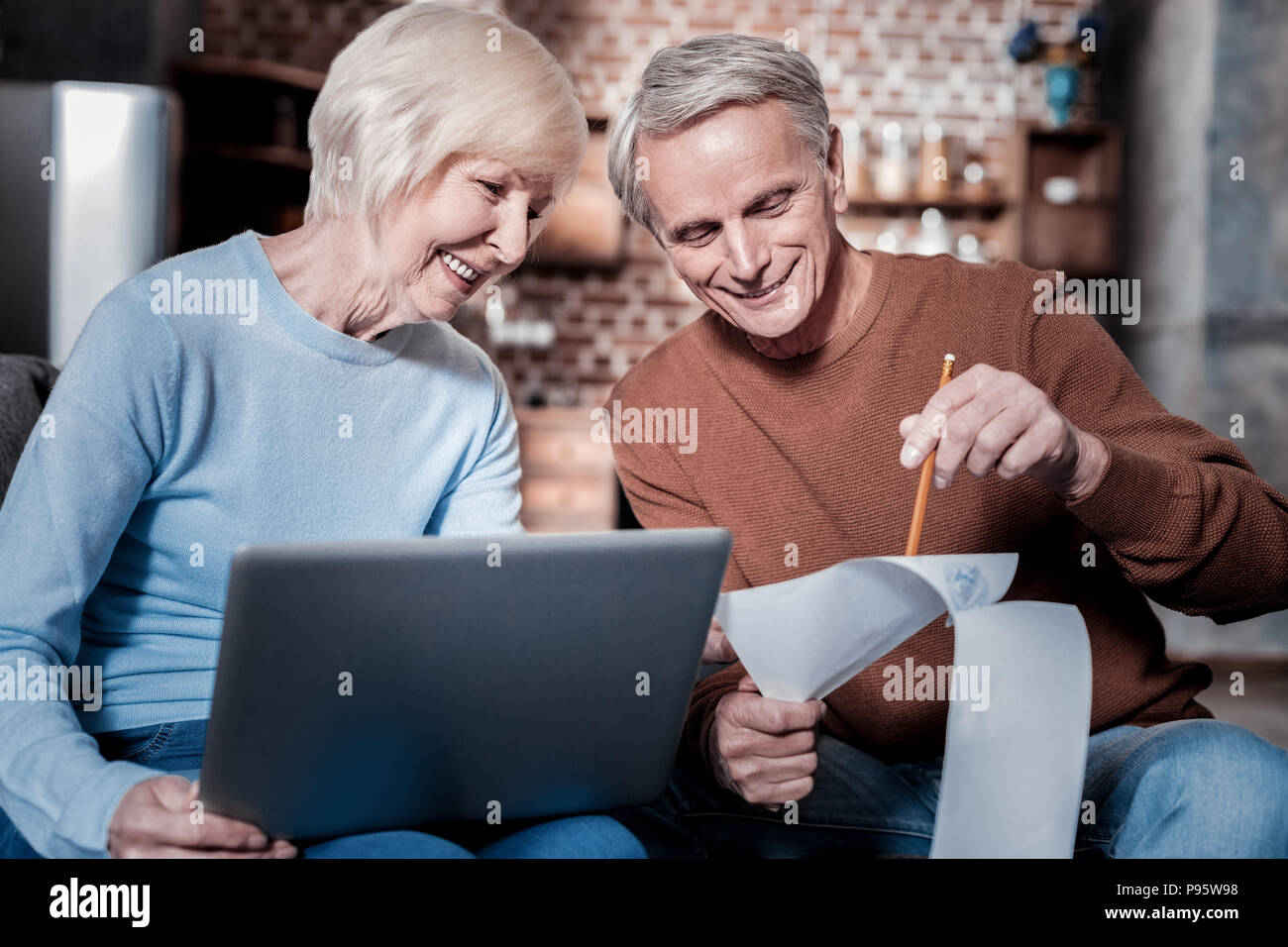 Man woman looking calculations hi-res stock photography and images - Alamy