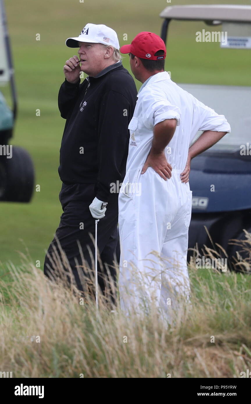 US President Donald Trump (left) on his golf course at the Trump ...