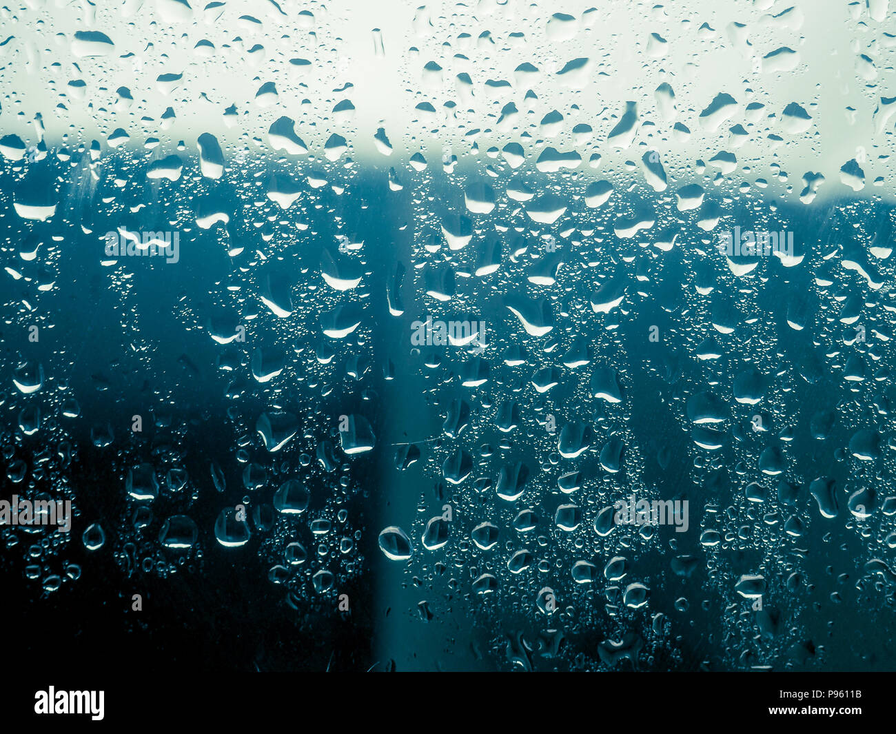 Water drop on the glass of windows background, raining on the glass off ...