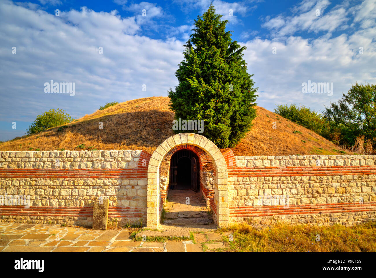 Entrance and stone wall of ancient sanctuary Stock Photo - Alamy