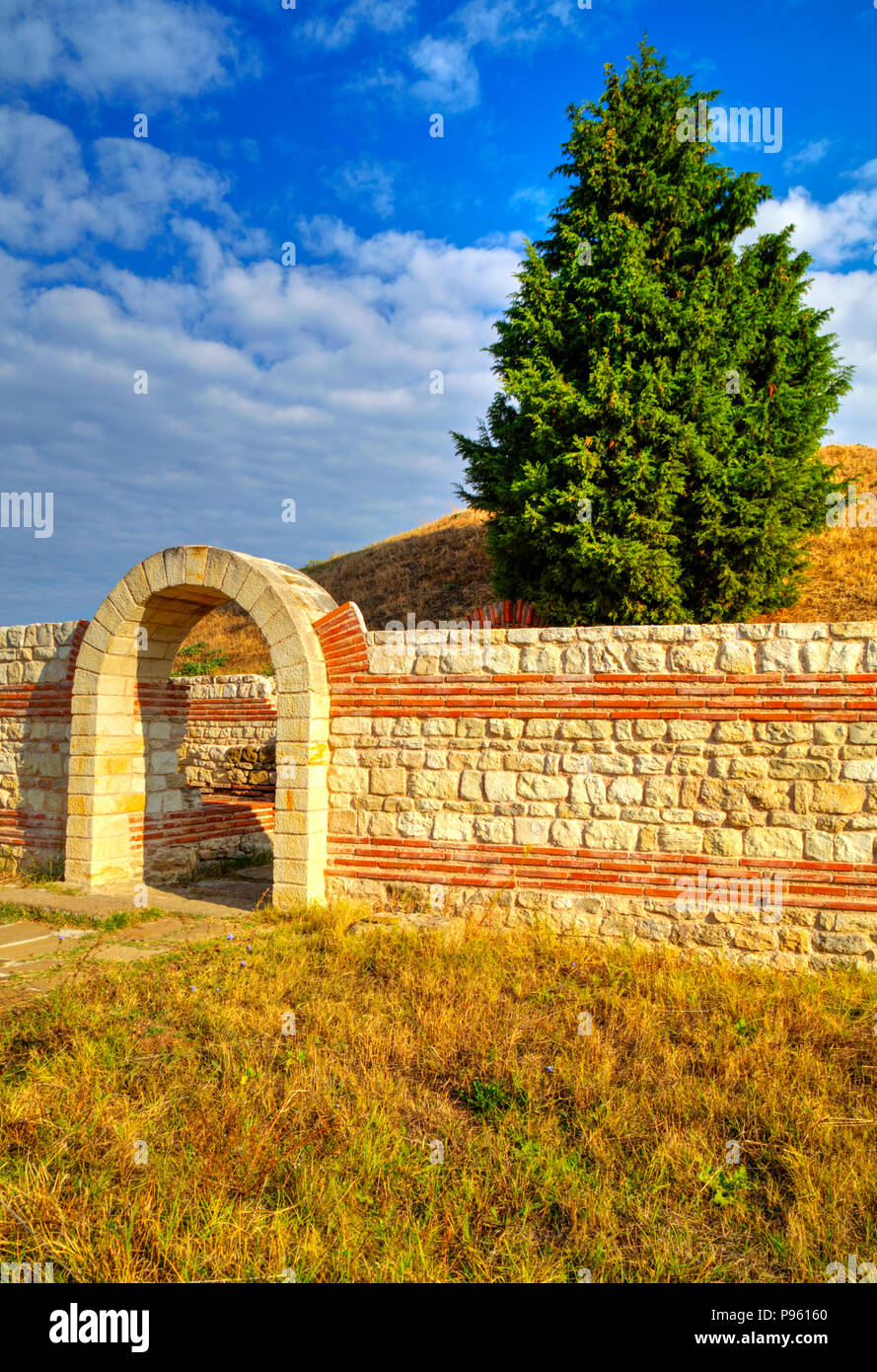 Entrance and stone wall of ancient sanctuary Stock Photo - Alamy