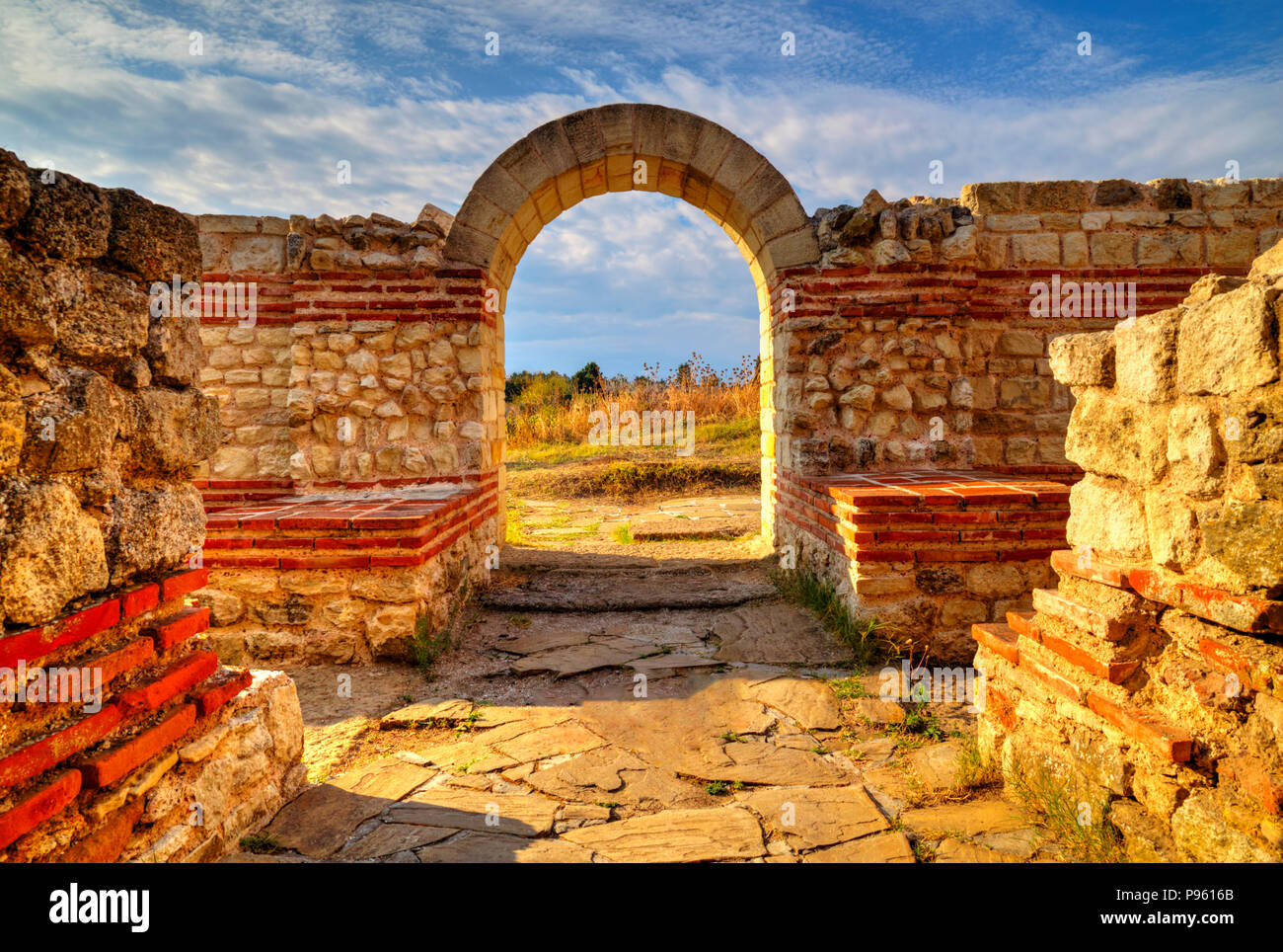 Entrance and stone wall of ancient fortress Stock Photo - Alamy