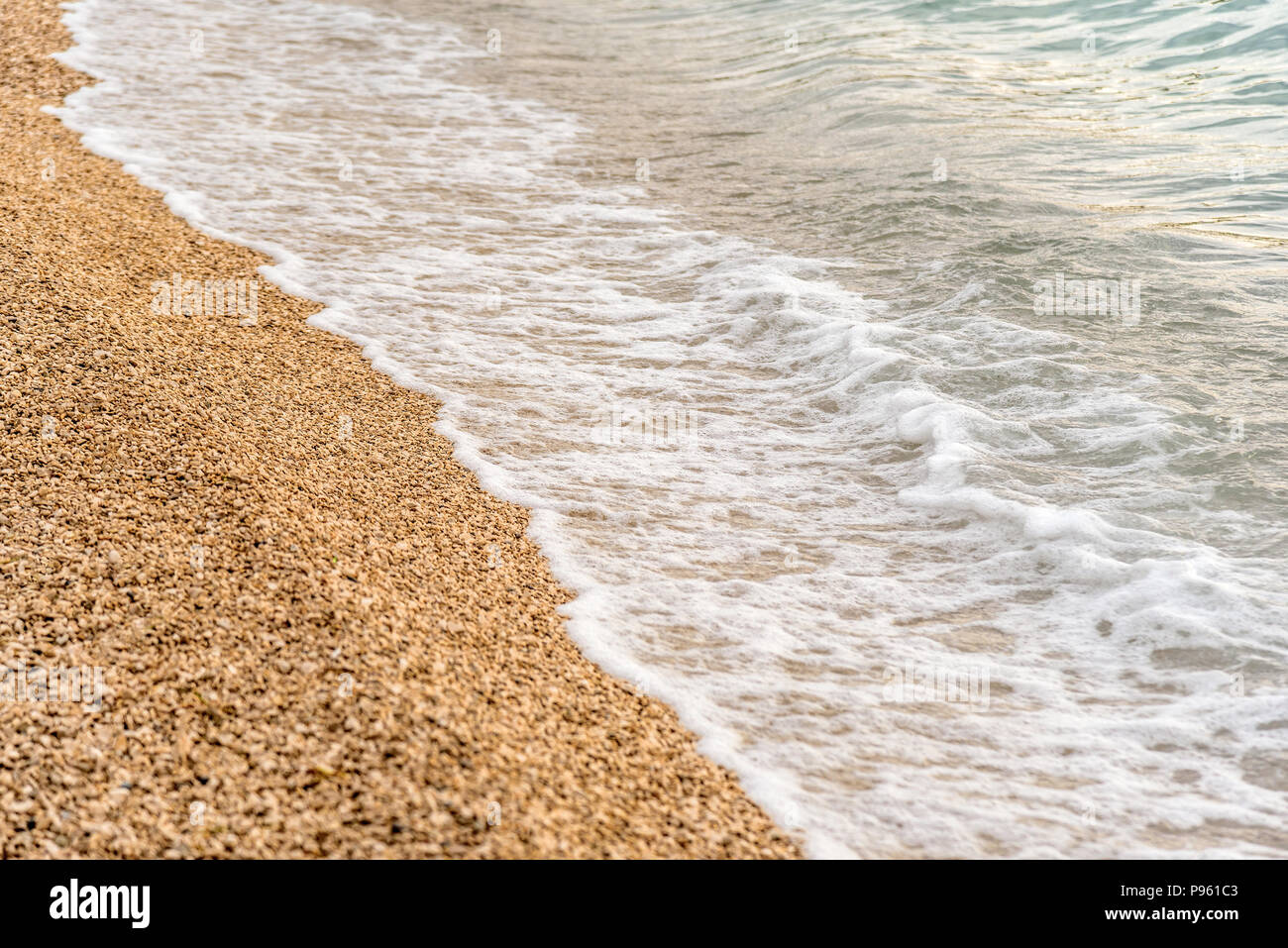 Sea surf on a stony beach Stock Photo - Alamy